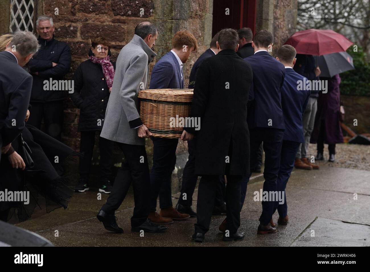 Pall bearers carry the casket at the funeral of TV presenter and ...