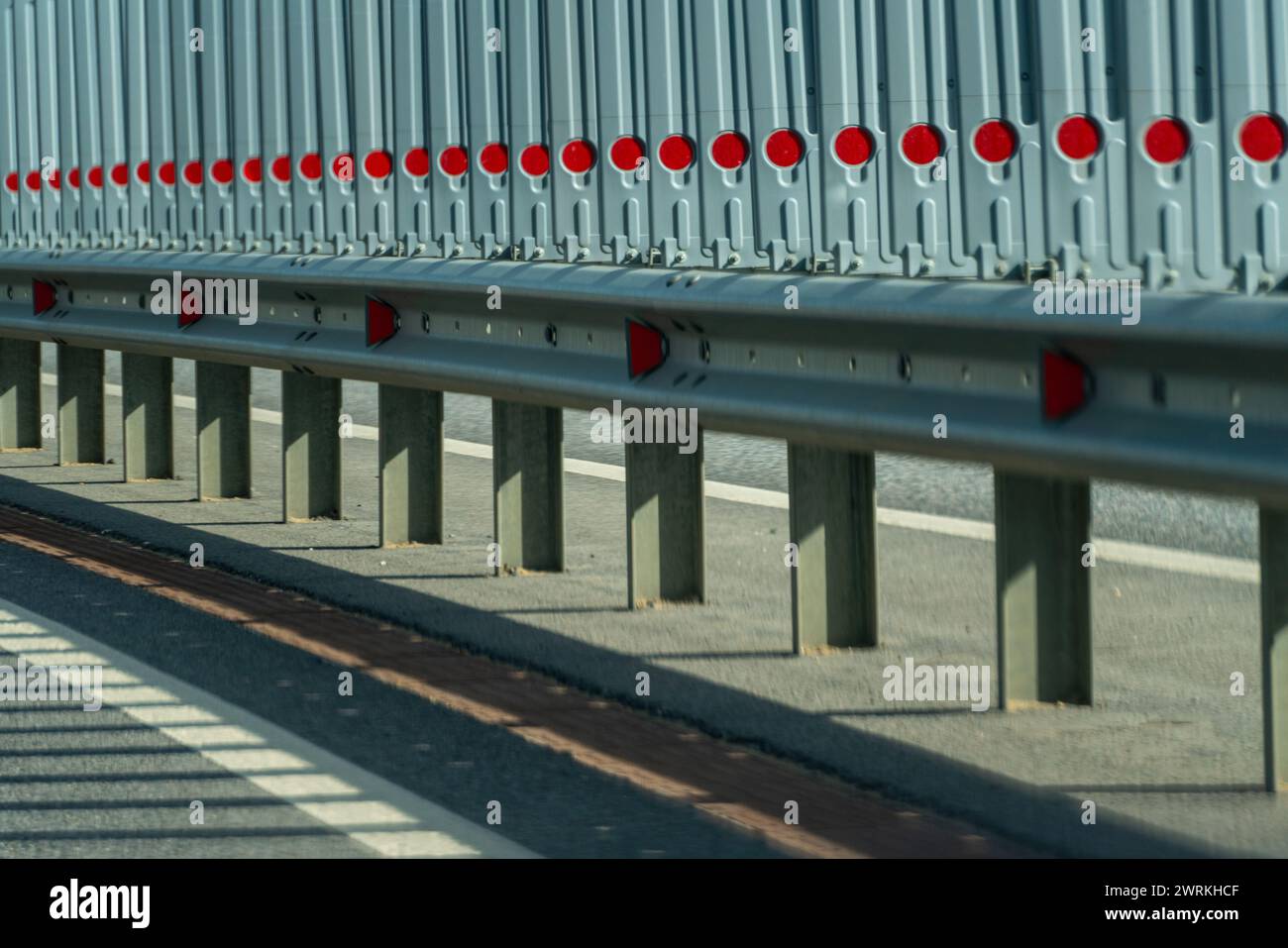 Safety barriers on highway. Anodized safety steel barrier. Enhancing ...