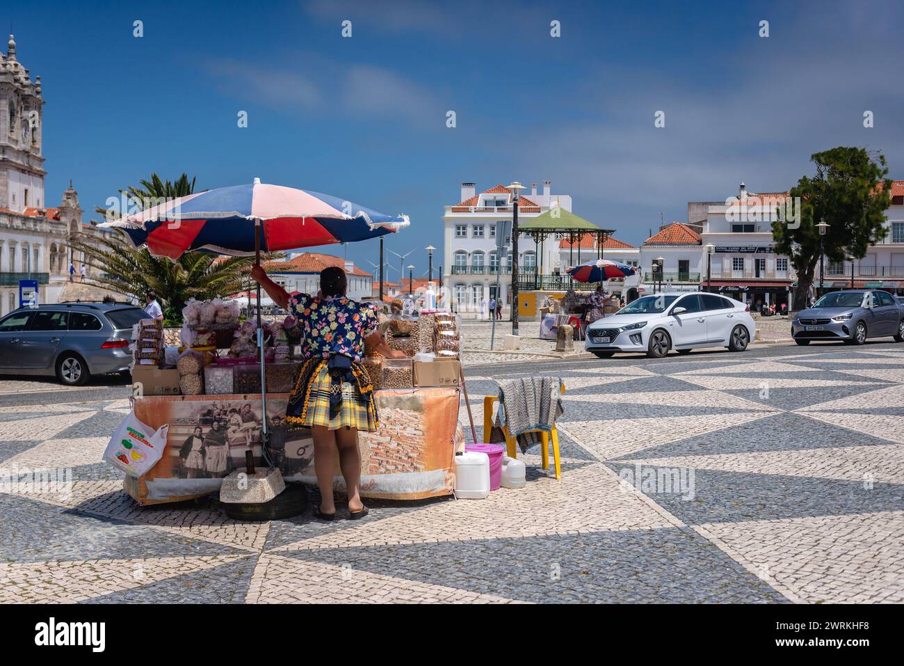 Women wears traditional dress on a stall on Nossa Senhora Square in ...