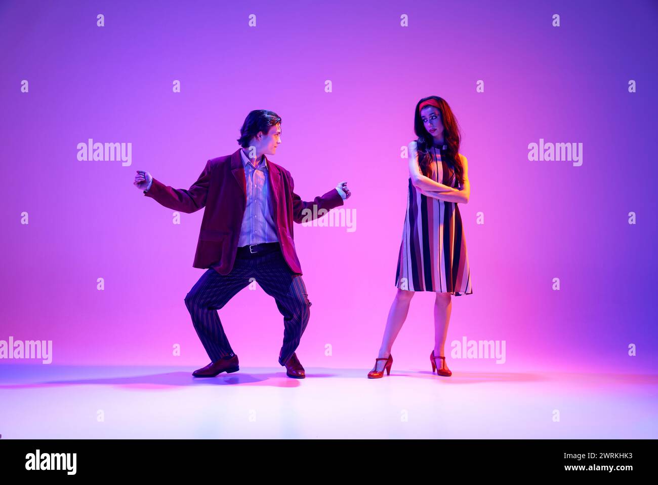 Young man and woman, stylish couple dancing retro dance, boogie woogie ...
