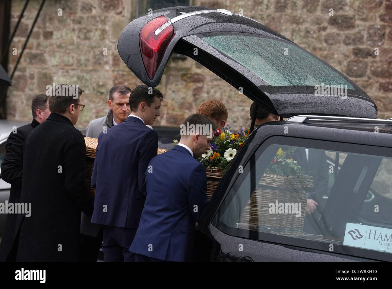Pall bearers carry the casket at the funeral of TV presenter and ...