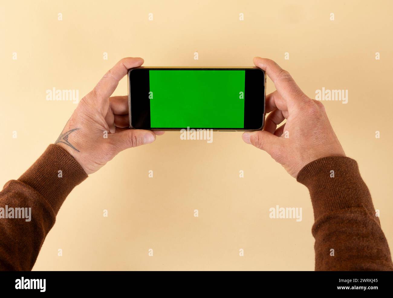 Human hands holding smartphone with green screen background Stock Photo ...