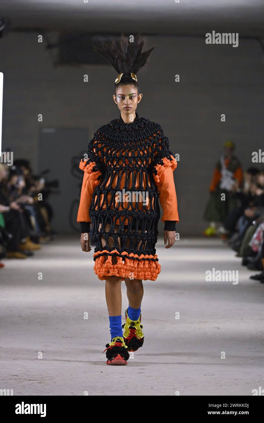 A model walks on the runway at the Noir fashion show during the Fall ...