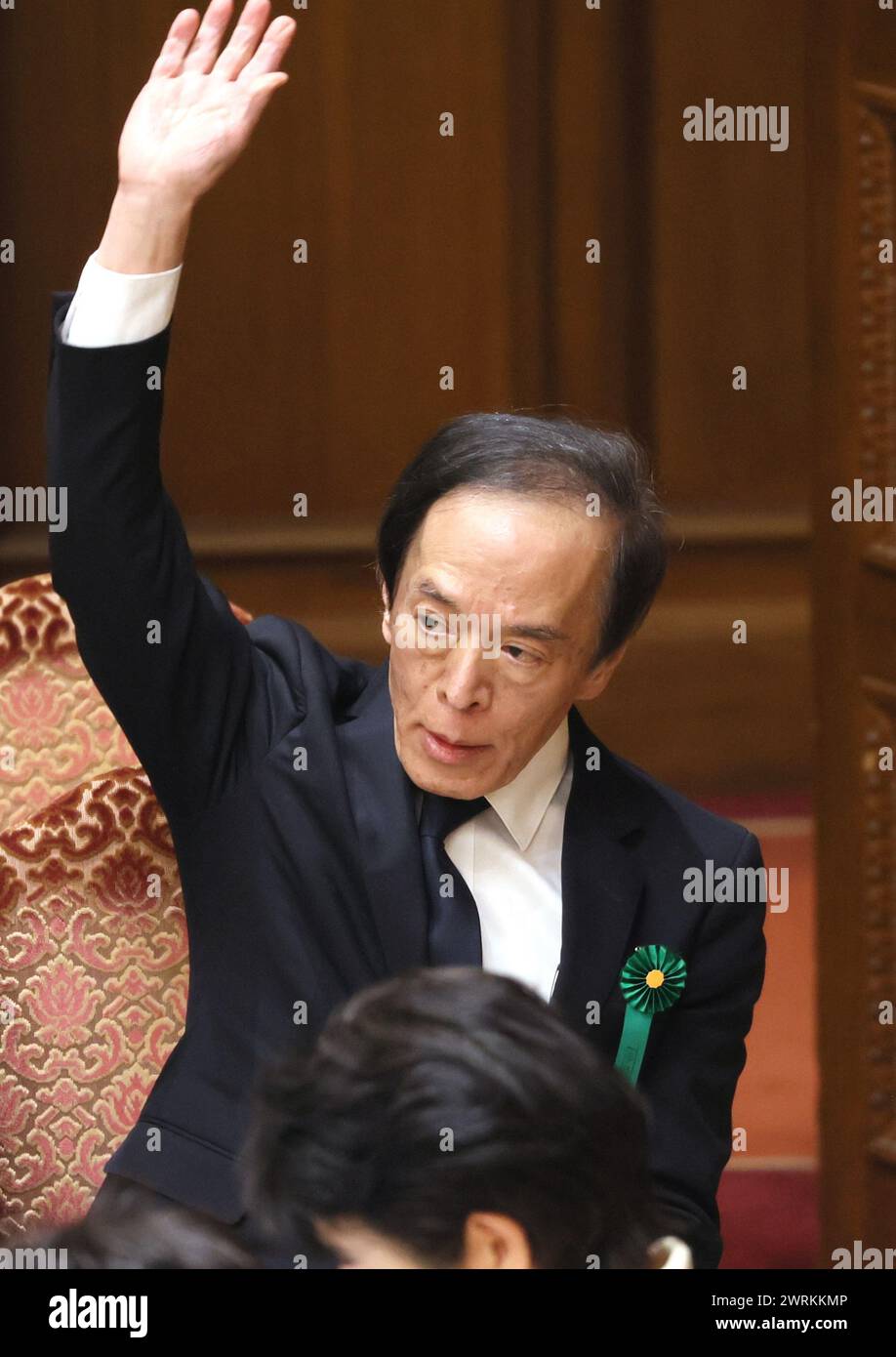 March 13, 2024, Tokyo, Japan - Bank of Japan Governor Kazuo Ueda raises ...