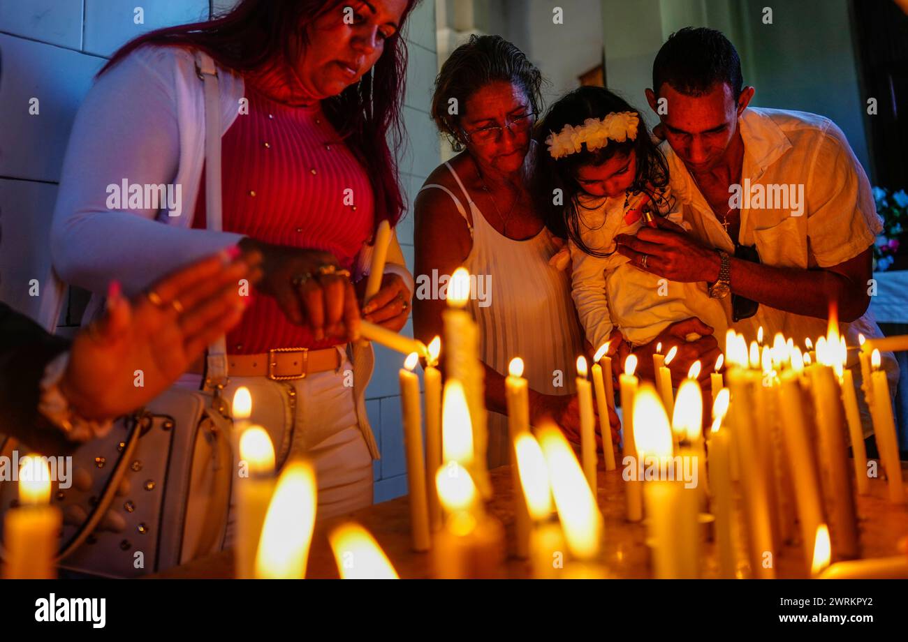 People light candles in honor of Cuba's patron saint, the Virgin of ...