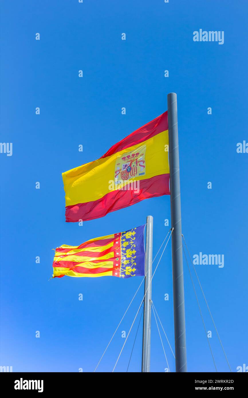 National and regional flags in the marine harbor of Valencia, Spain ...