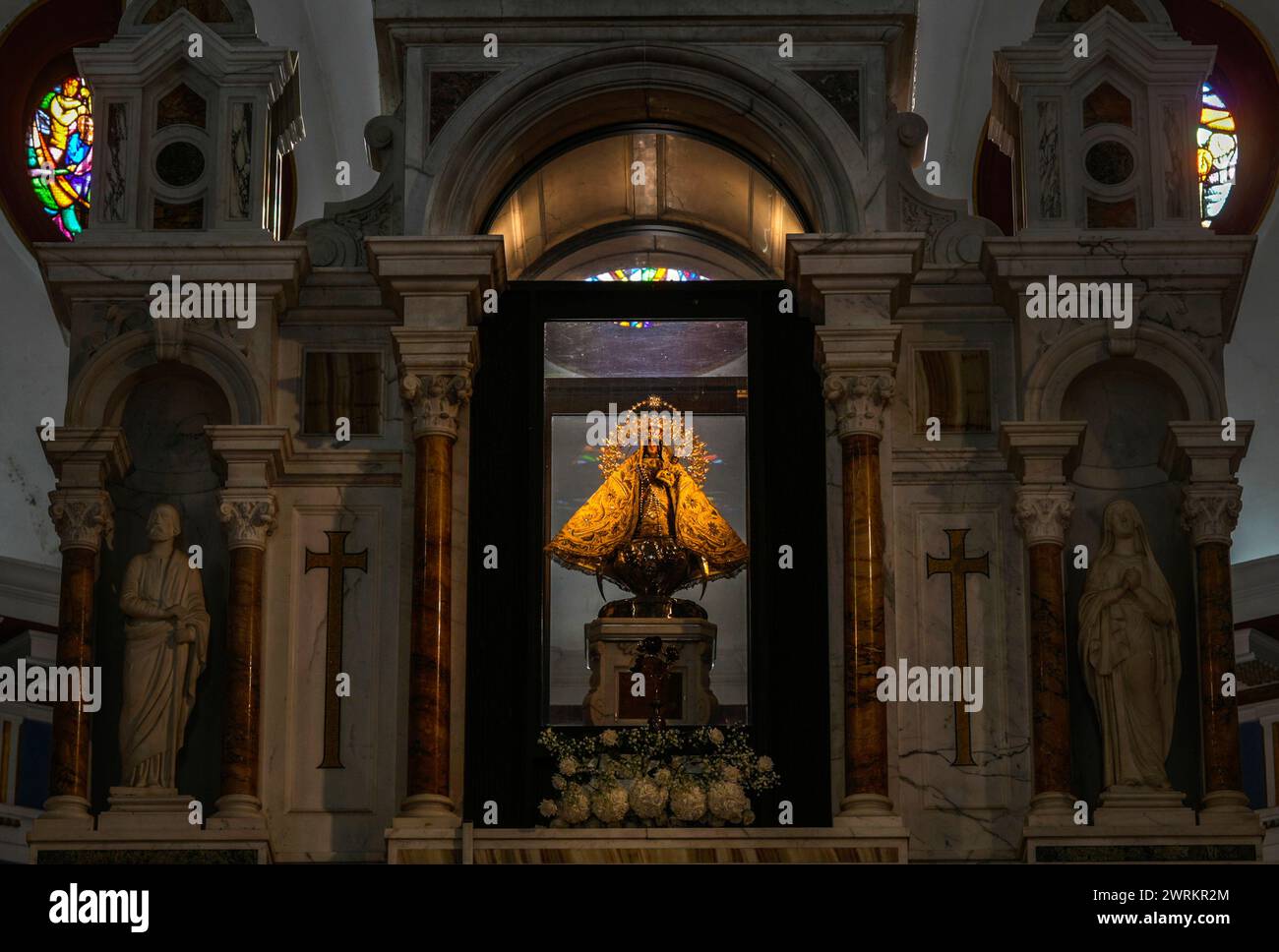 The original statue of the Virgin of Charity of El Cobre stands behind ...