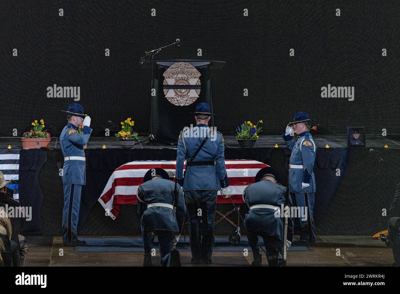 Washington State Patrol troopers solemnly perform a ceremony honoring ...