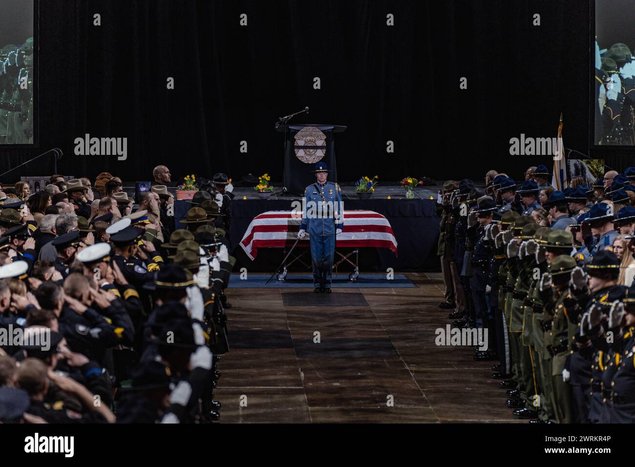 Washington State Patrol troopers solemnly perform a ceremony honoring ...