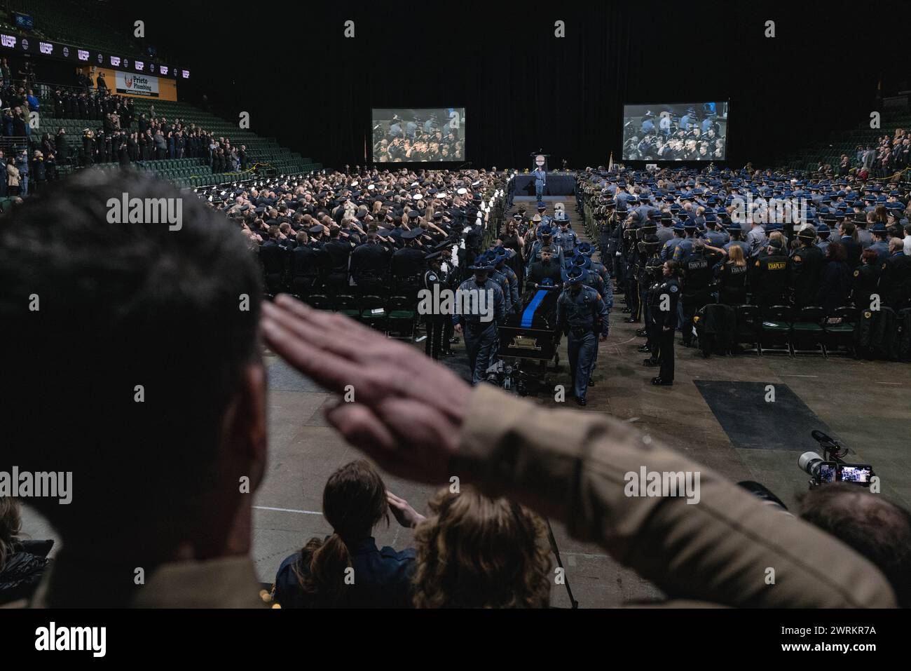 Washington State Patrol troopers solemnly perform a ceremony honoring ...