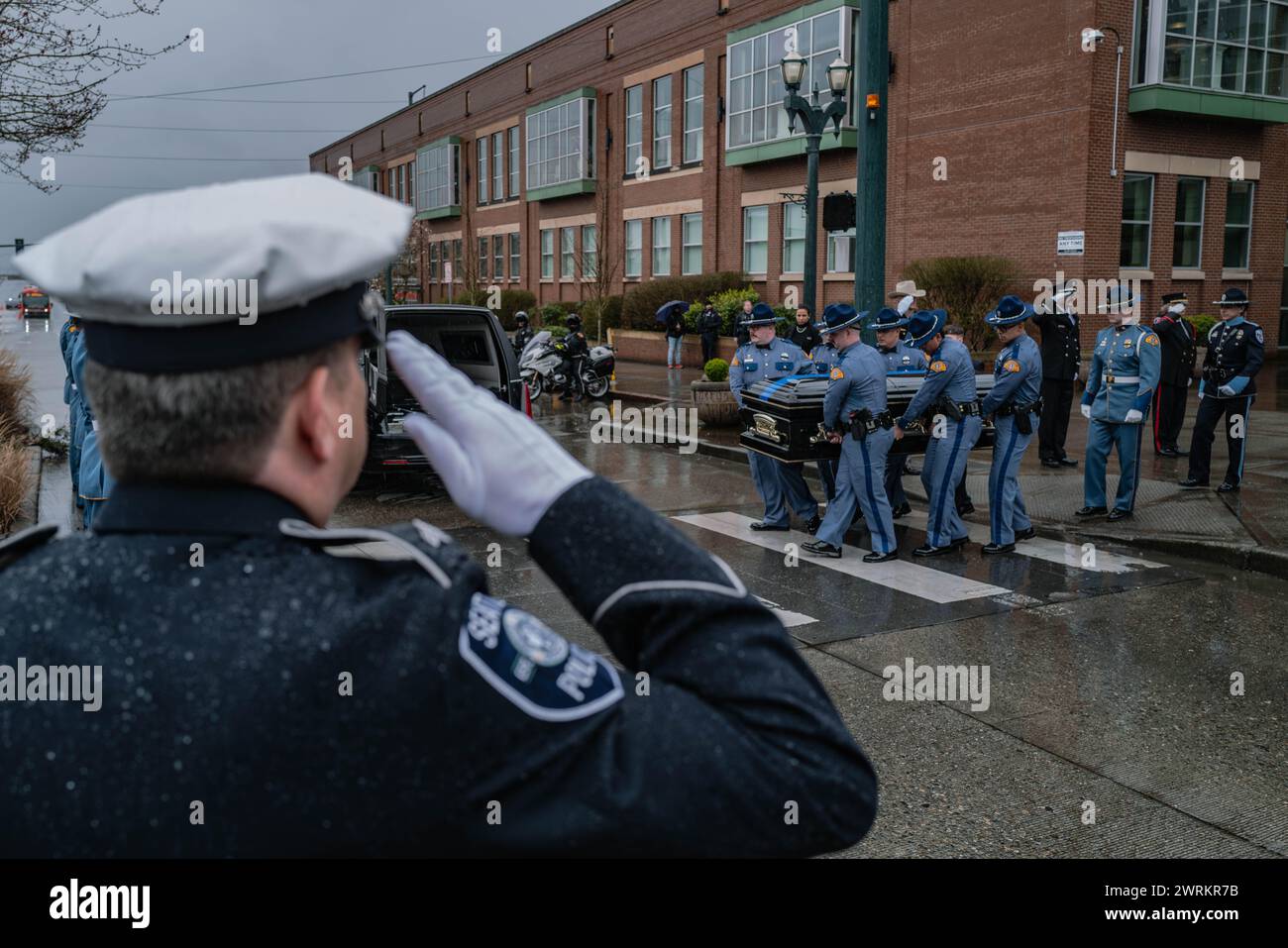 Washington State Patrol troopers accompany the casket of their fallen ...