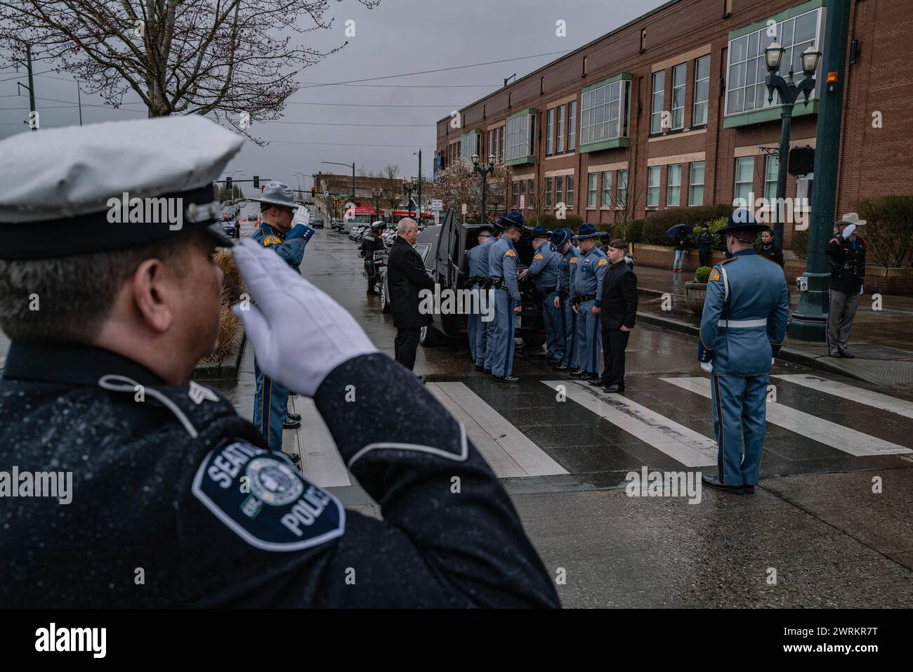 Washington State Patrol troopers accompany the casket of their fallen ...