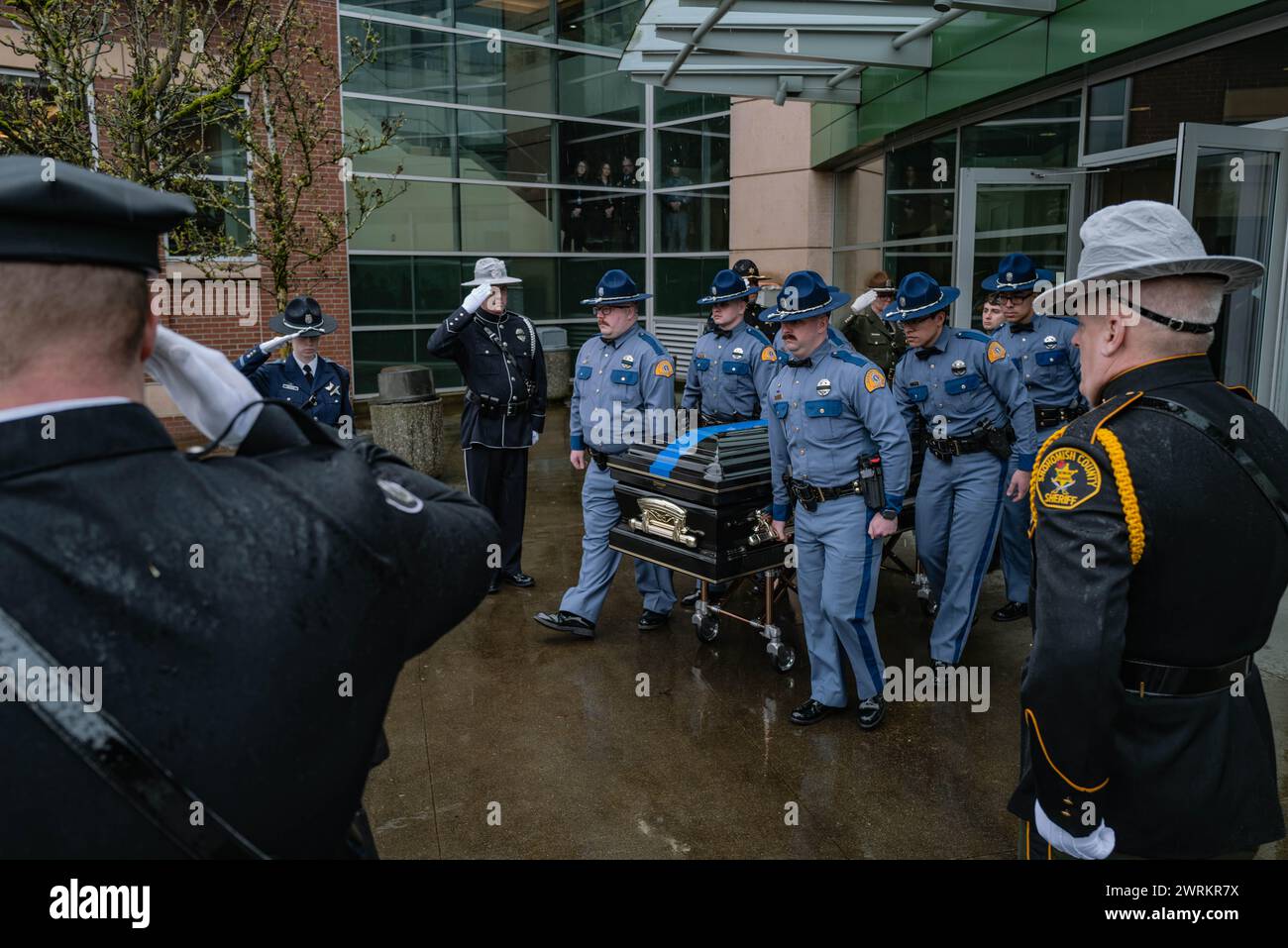 Washington State Patrol troopers accompany the casket of their fallen ...