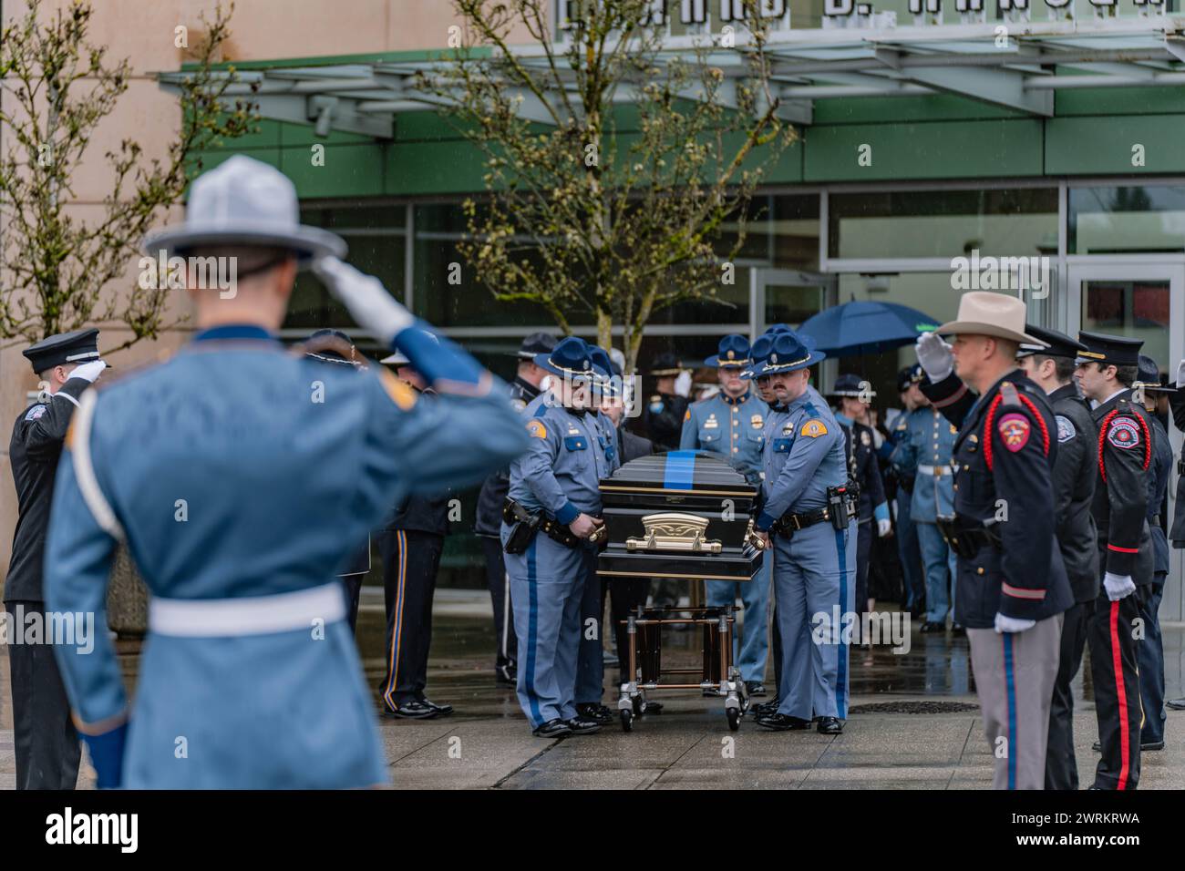 Washington State Patrol troopers accompany the casket of their fallen ...