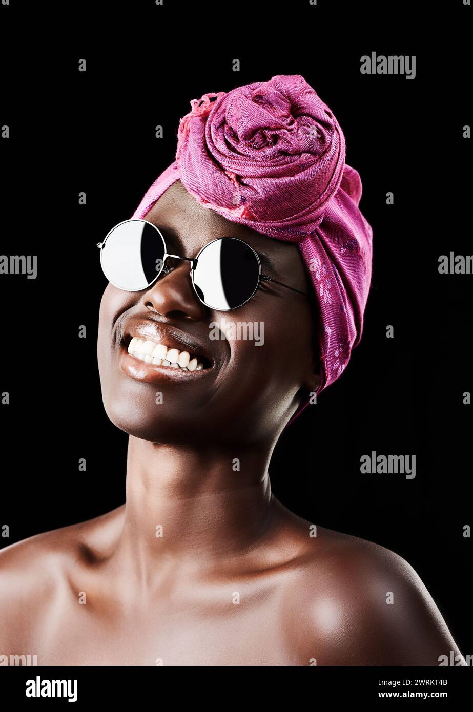 Face, turban and smile with black woman in studio isolated on dark ...