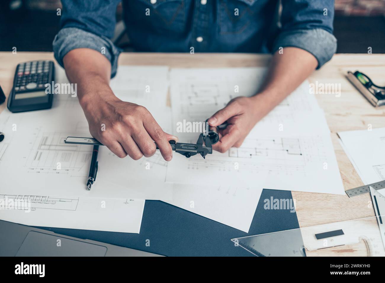 Architecture hands hold vernier caliper working and checking joint pipe ...