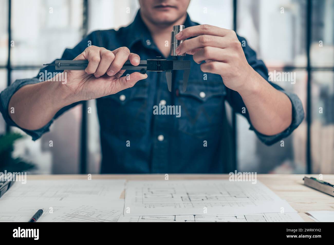 Architecture hands hold vernier caliper working and checking joint pipe ...