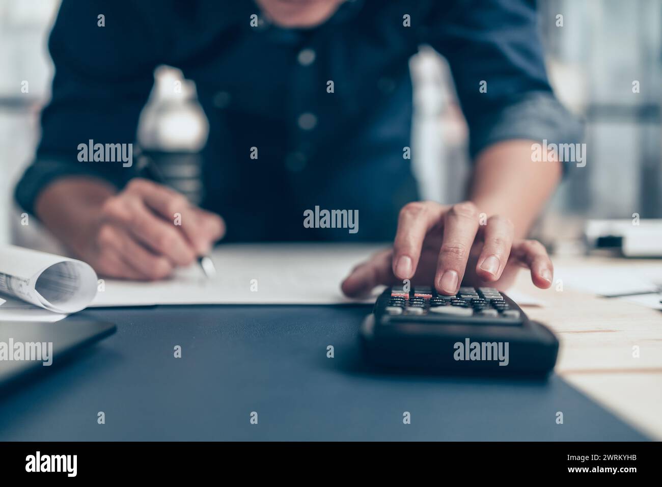 Architect engineer use calculator for calculate drawing design working ...