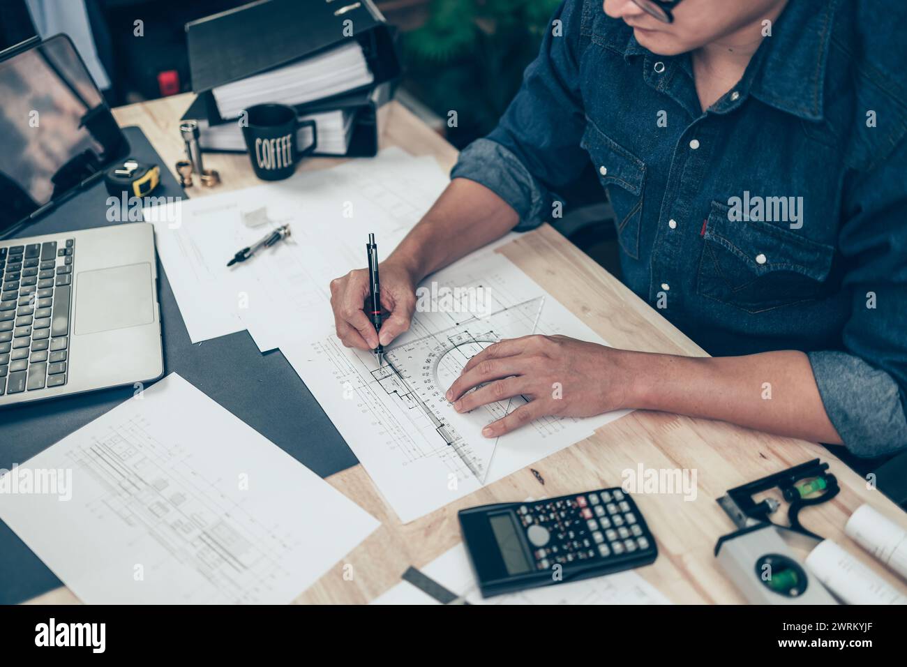 Architect engineer use pen drawing design working on blueprint. House ...