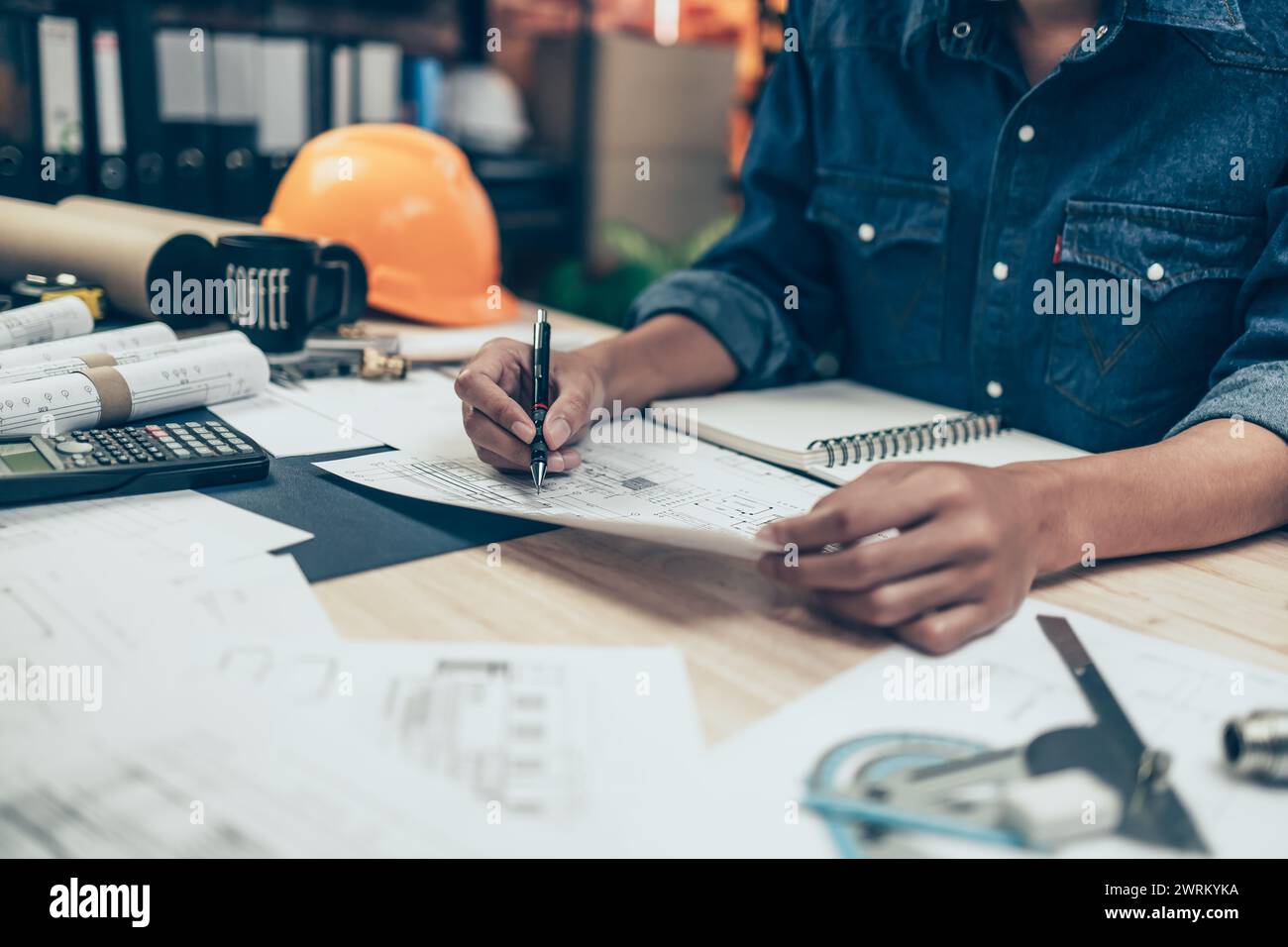 Architect engineer use pen drawing design working on blueprint. House ...