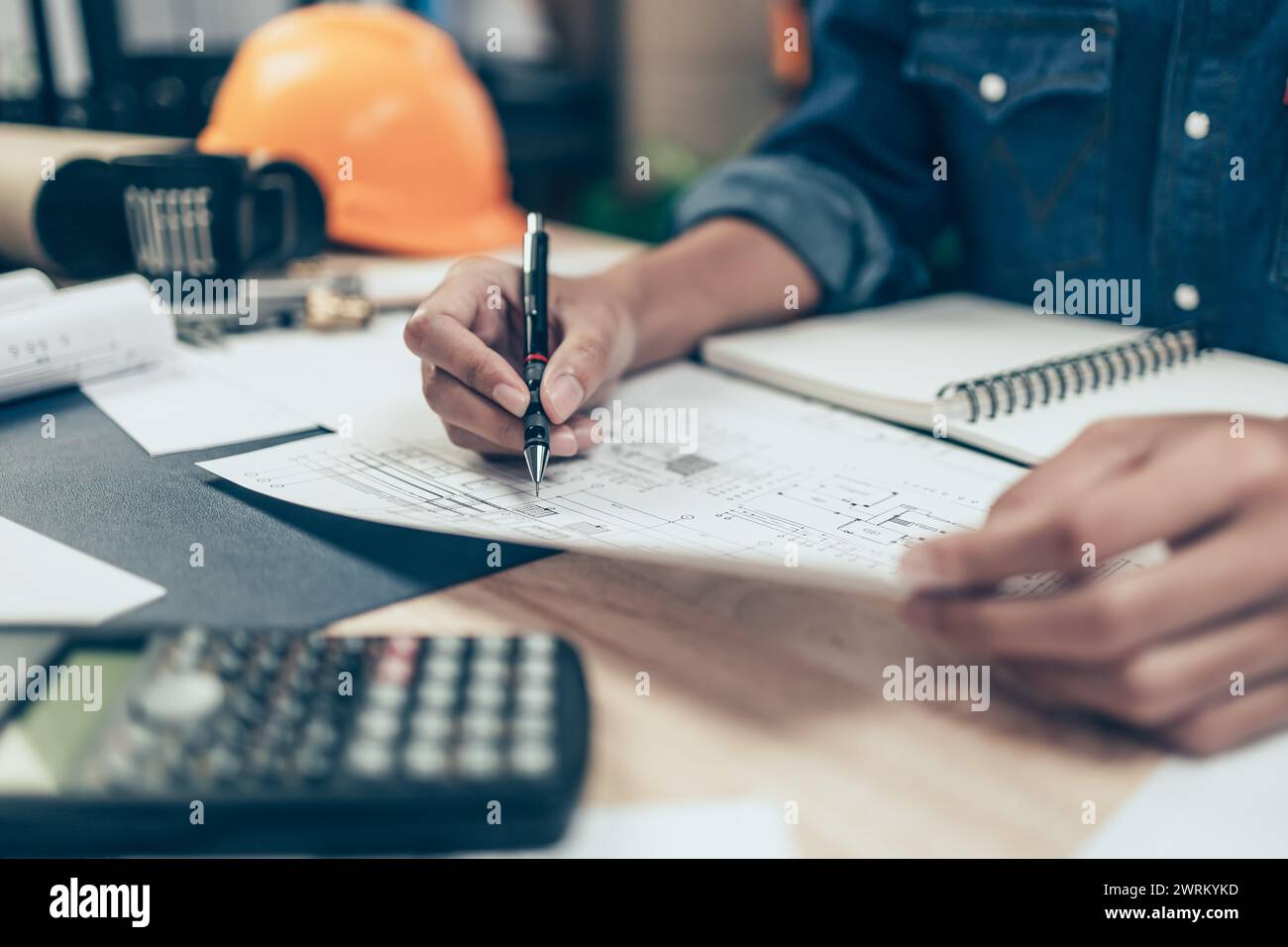 Architect engineer use pen drawing design working on blueprint. House ...