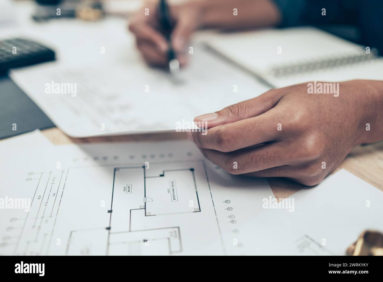 Architect engineer use pen drawing design working on blueprint. House ...