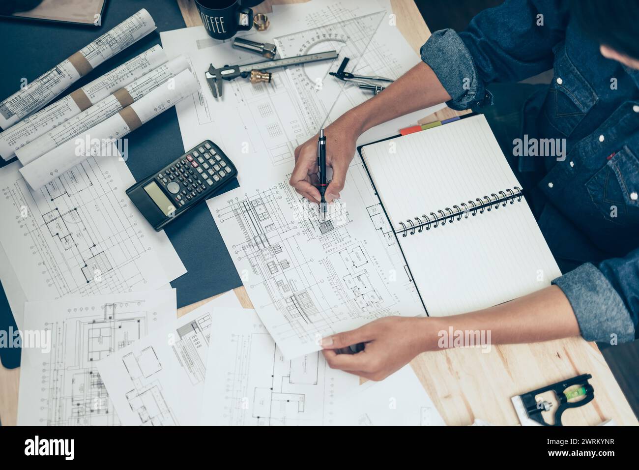 Architect engineer use pen drawing design working on blueprint. House ...