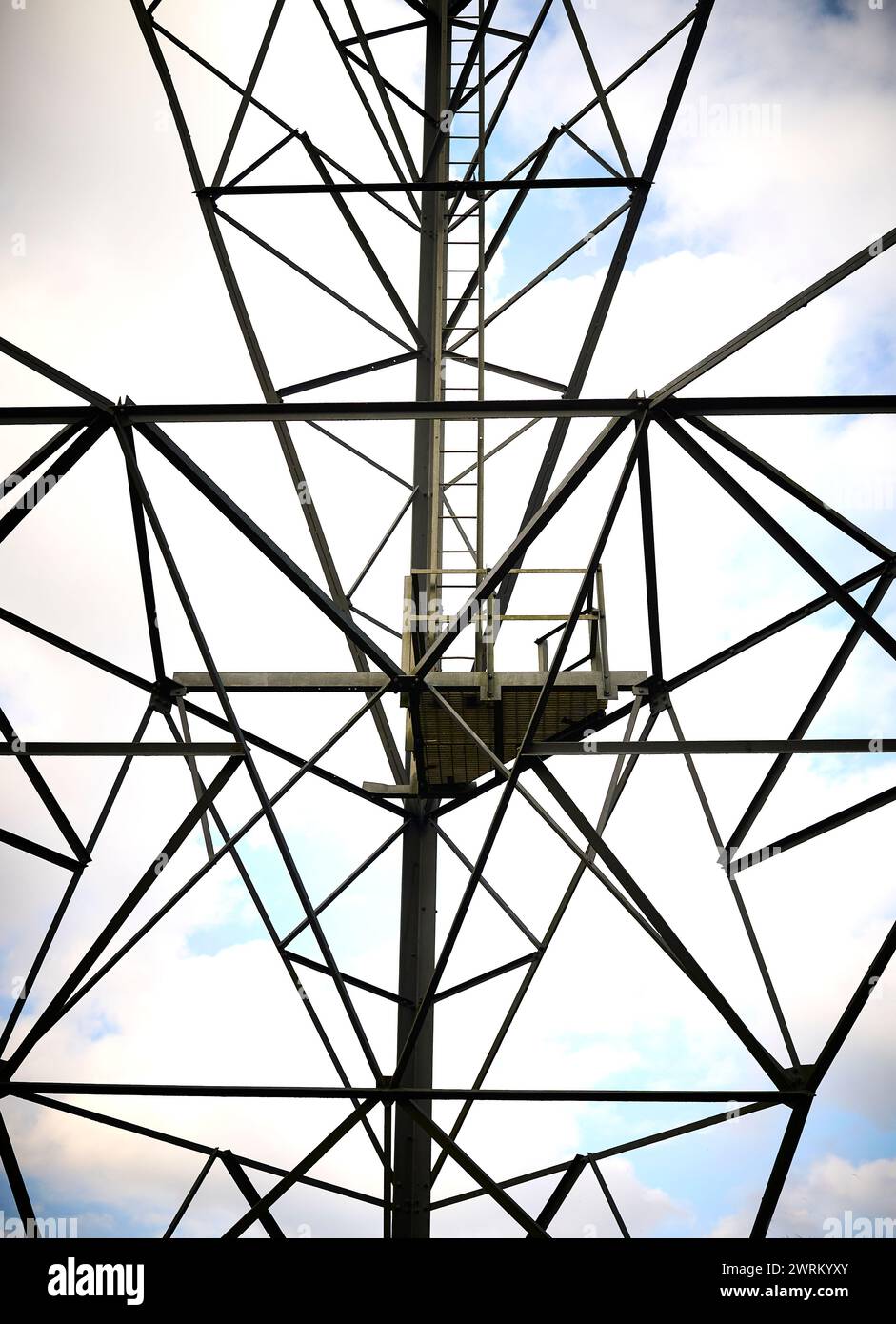 The triangular shaped structure of an electricity pylon silhouetted ...