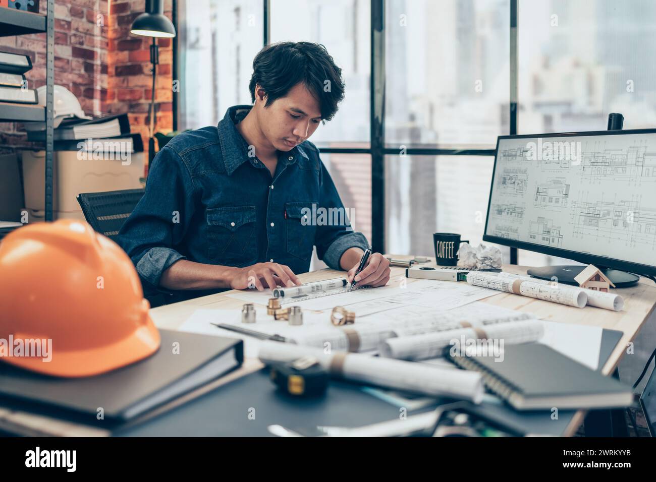 Architect engineer use pen and mini T-slide drawing design working on ...