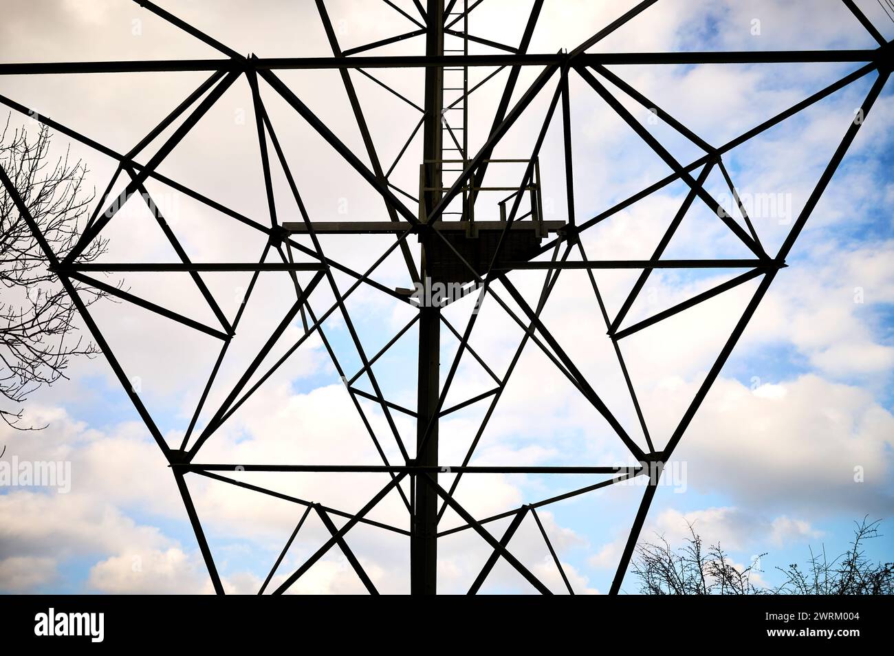 The triangular shaped structure of an electricity pylon silhouetted ...