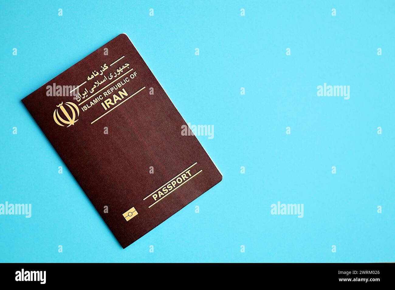 Red Islamic Republic of Iran passport on blue background close up ...