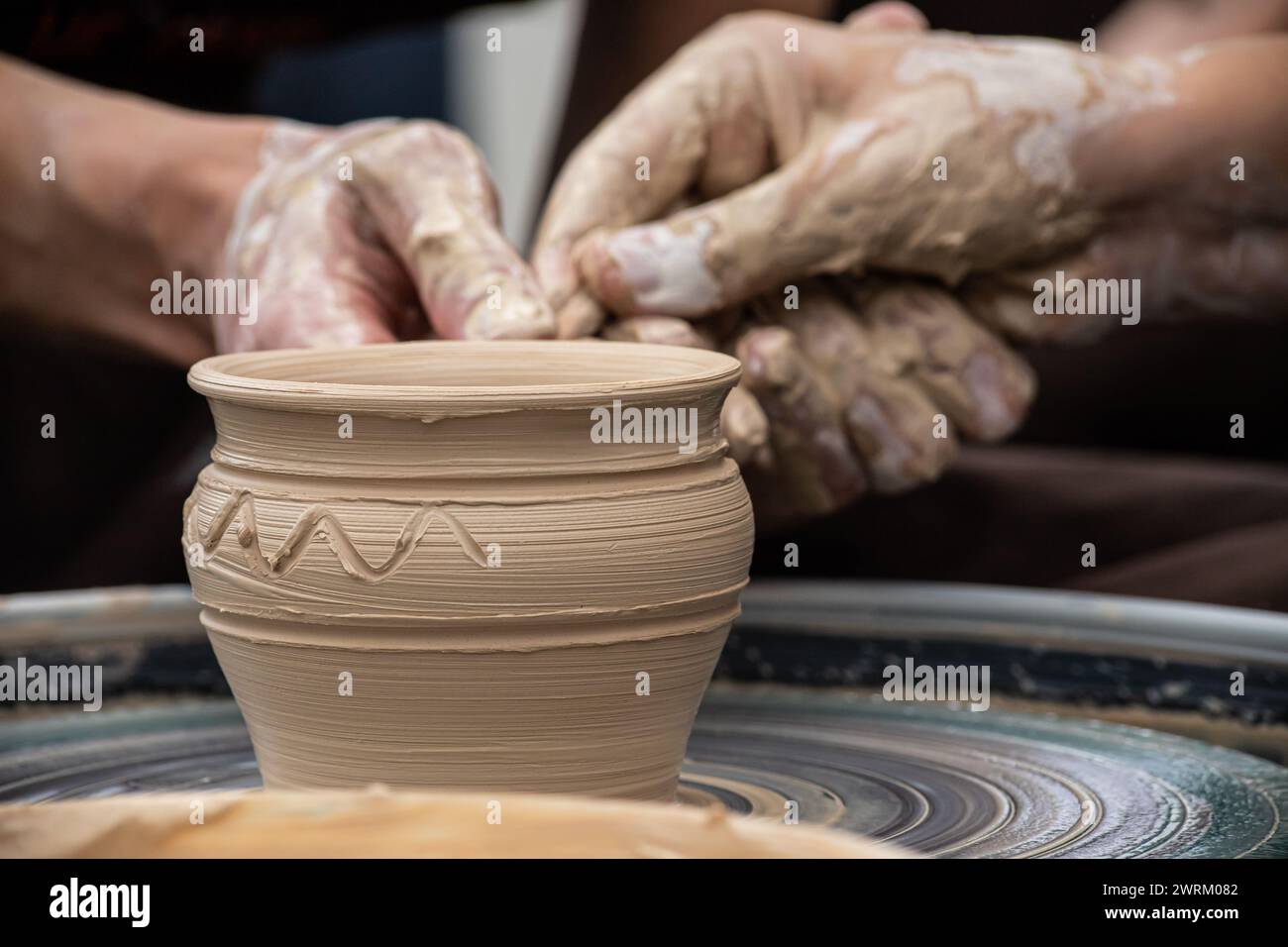 Master class on modeling of clay on a potter's wheel In the pottery ...
