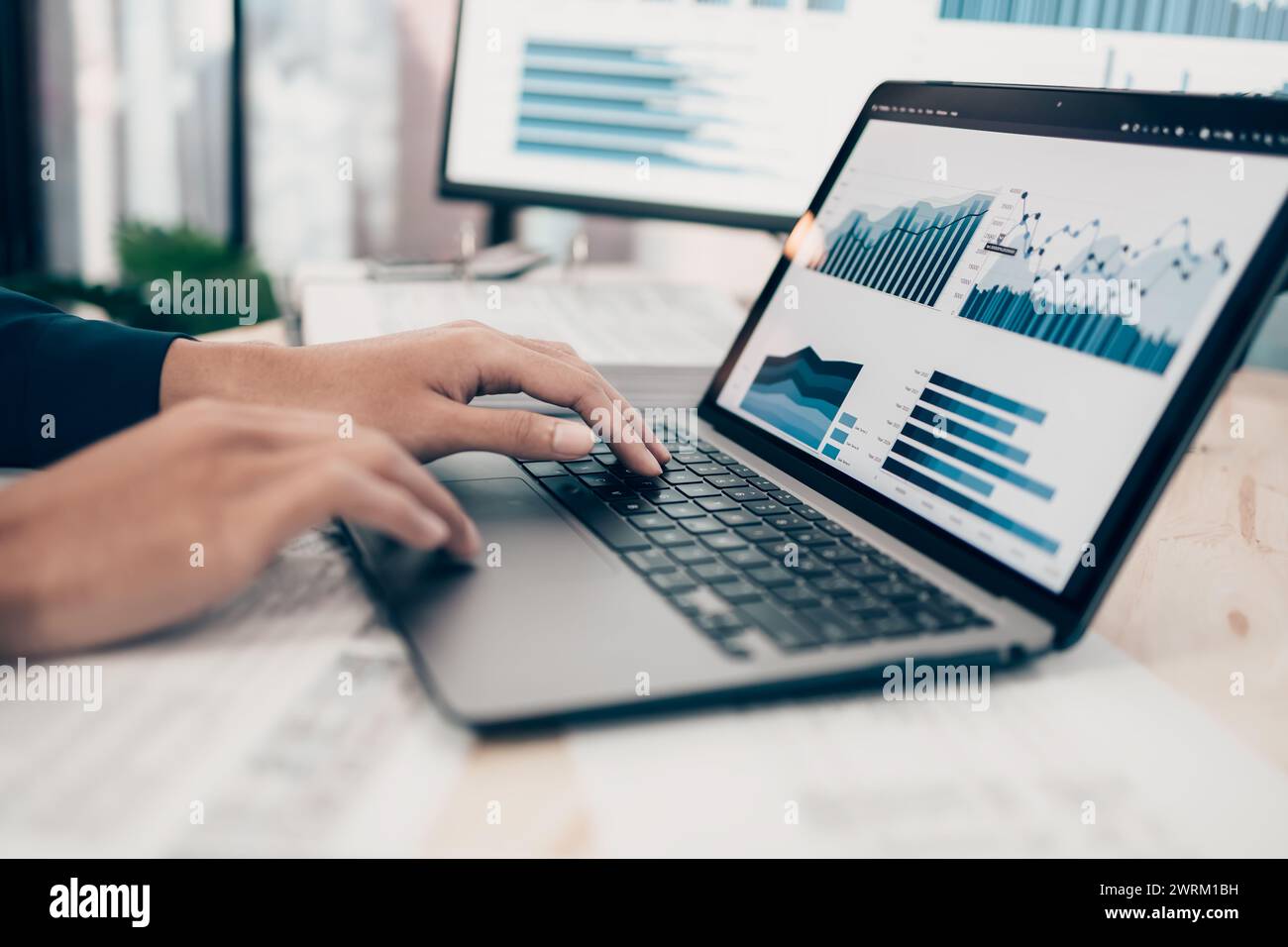 Investors working on desk office and use computer keyboard and laptop ...