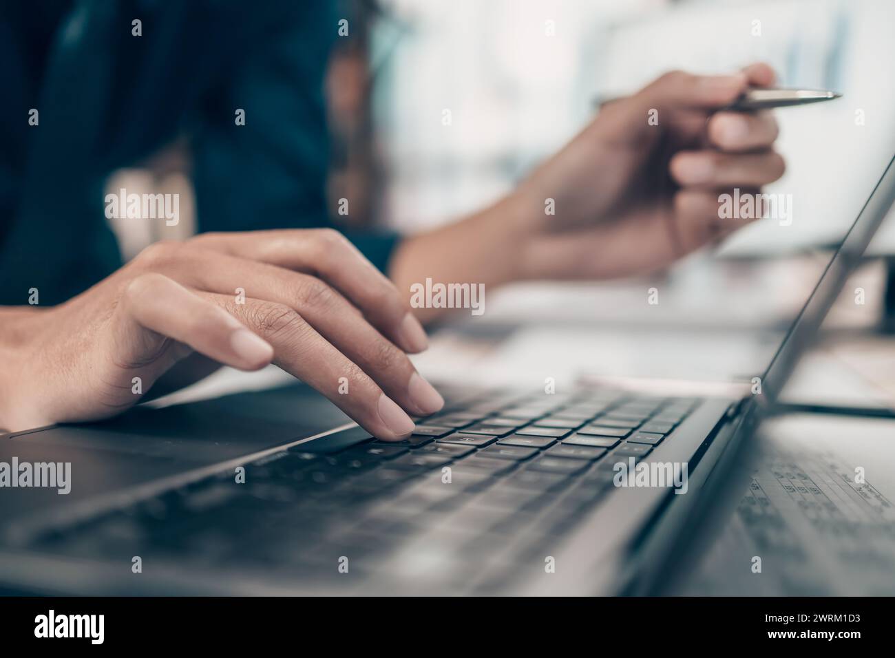 Investors working on desk office and use computer keyboard and laptop ...