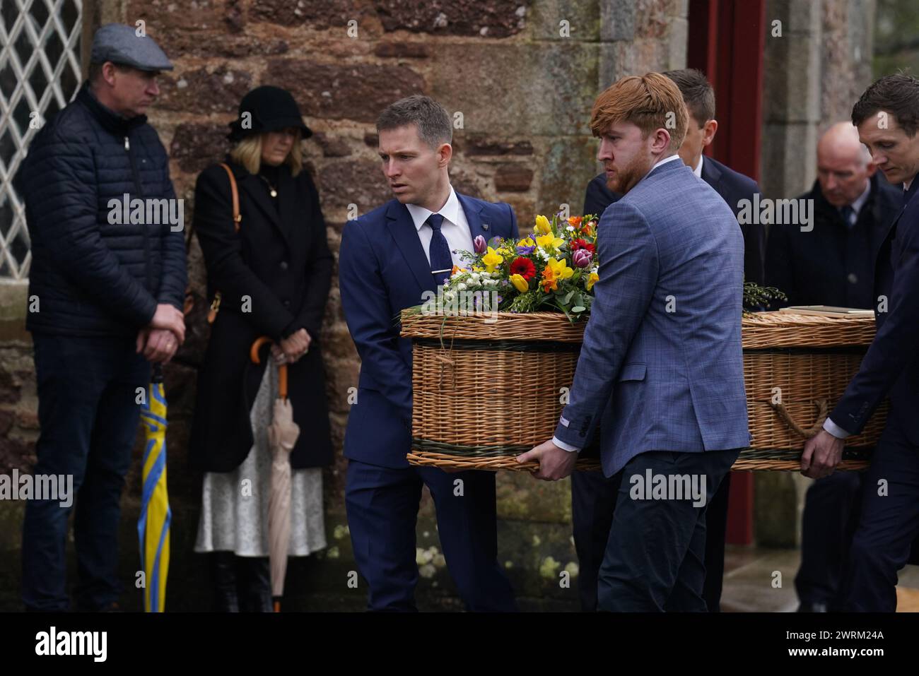 Nick Sheridan's brother Brian (front left) helps carry the casket from ...