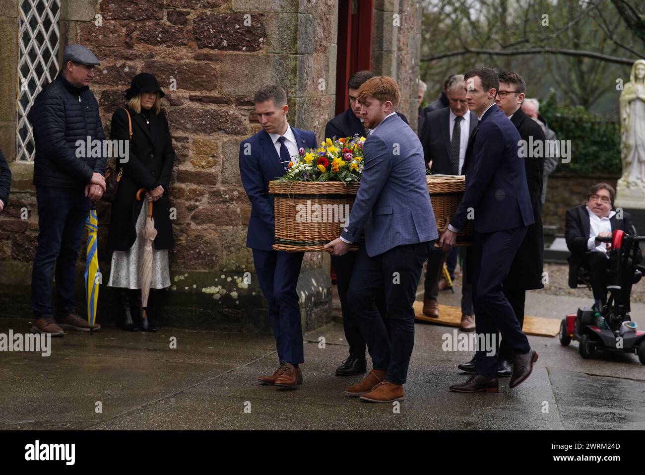 Nick Sheridan's brother Brian (front left) helps carry the casket from ...