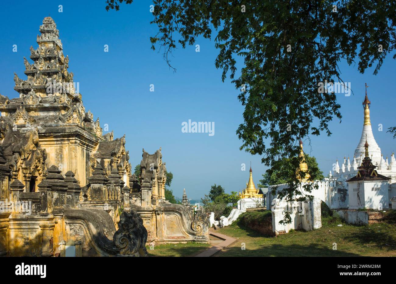 Burmese heritage architecture. Yellow moldy walls of Maha Aungmye ...