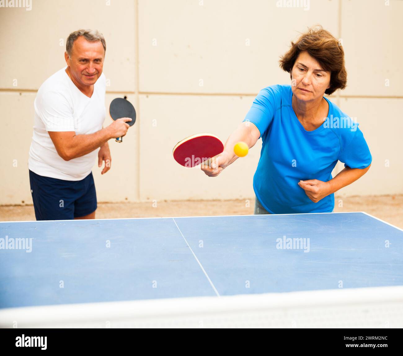 Beautiful mature woman playing tennis hi-res stock photography and ...