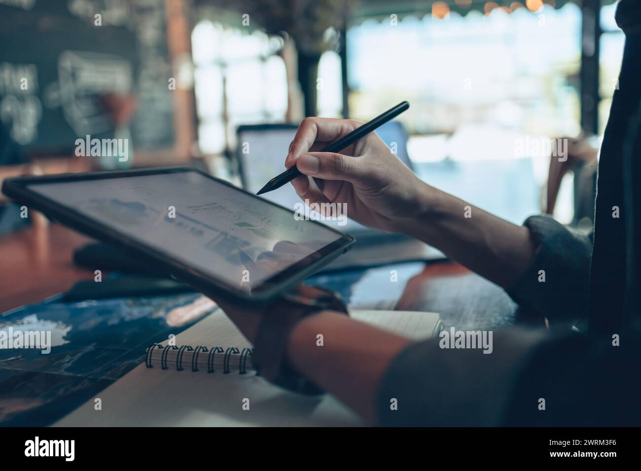 Travelers planning trips and use tablet to book hotels, buy plane ...