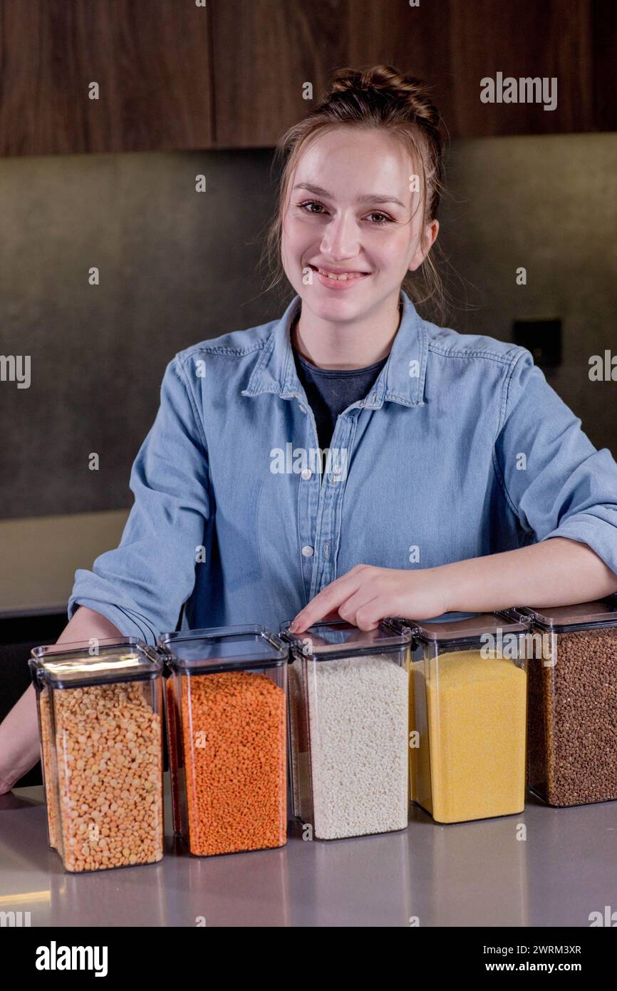 Layout and sorting of food products. Woman uses containers to organize ...