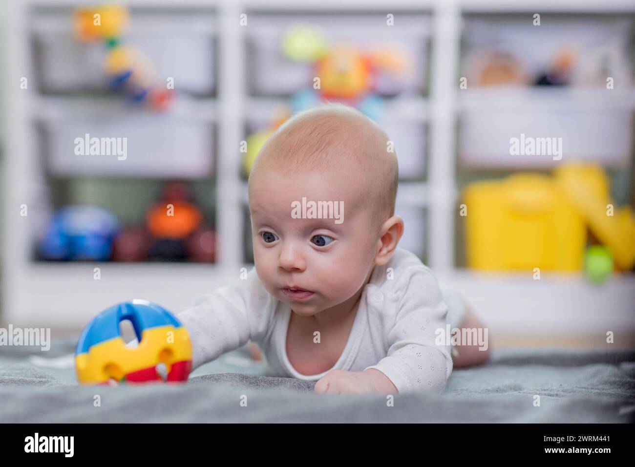 Baby crawling reaching hi-res stock photography and images - Alamy