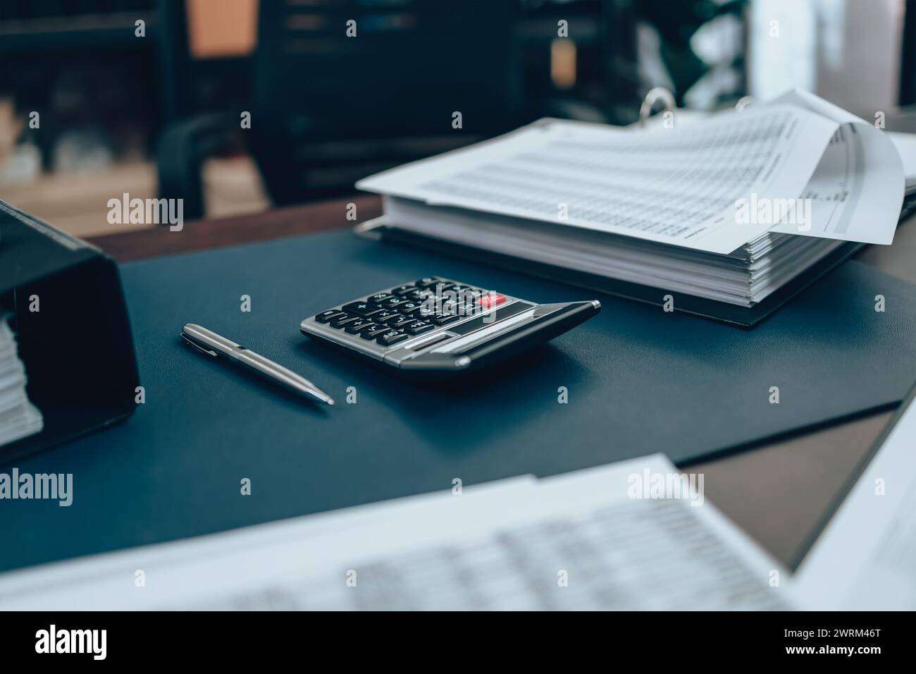 Investors working on desk office and using a calculator to calculate ...