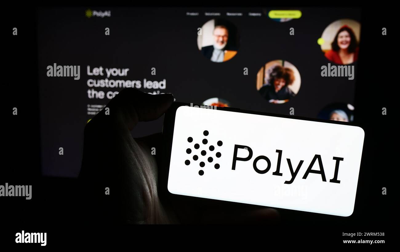 Person holding mobile phone with logo of conversational artificial intelligence company PolyAI ...