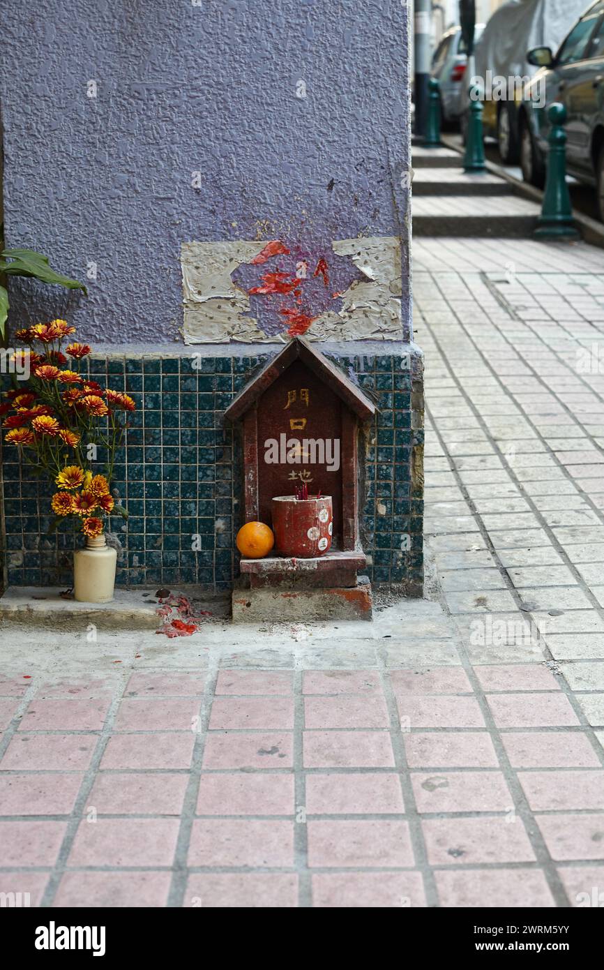 small decorated shrine on the corner of a house in shanghai. partly ...