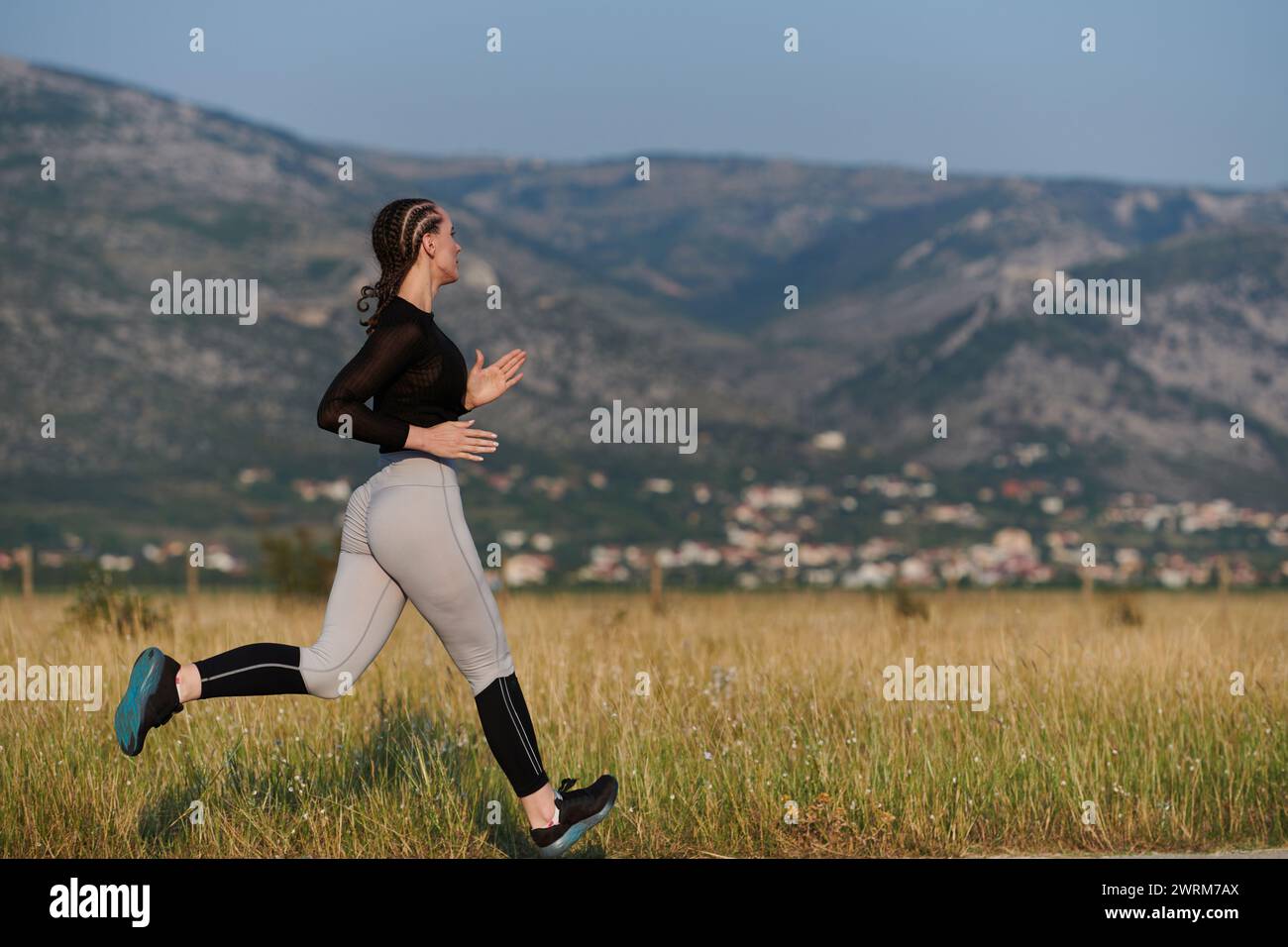 Solo Stride: Determined Athlete Woman Embarks on Fitness Journey for Marathon Preparation Stock ...