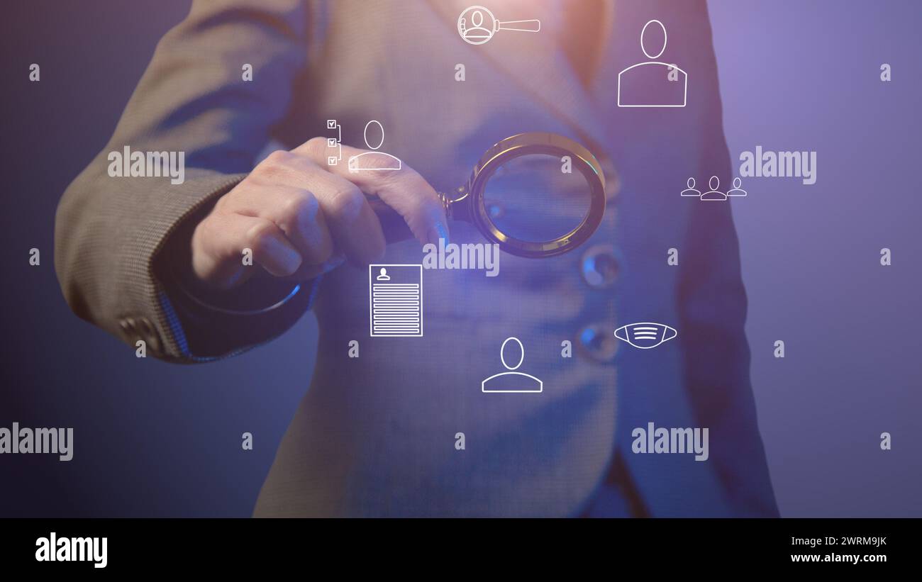 Cg tech collage. A female hand holds a magnifying glass against the ...