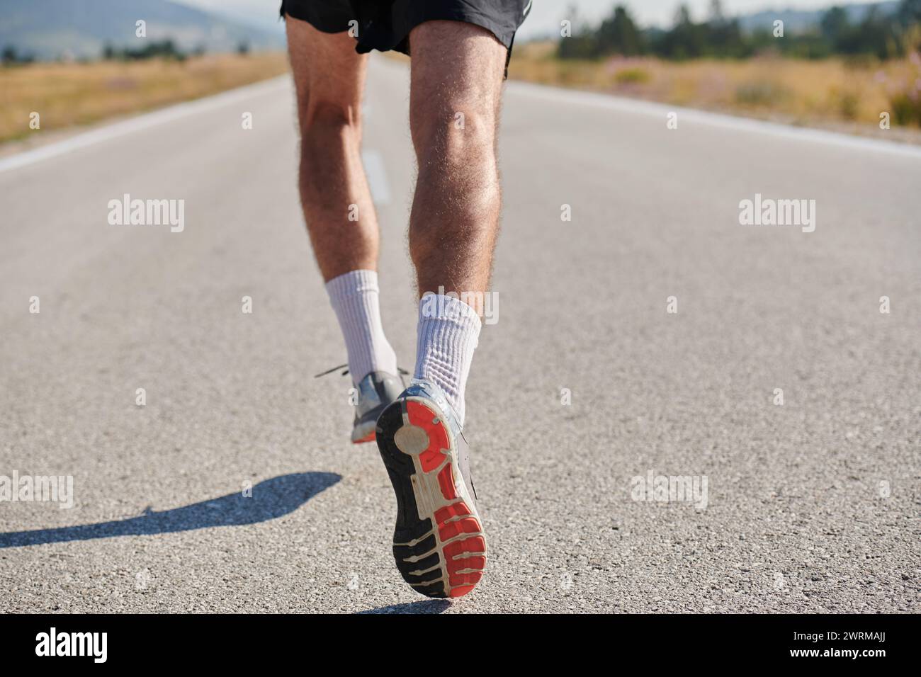 Athletic young man running in the nature. Healthy lifestyle Stock Photo ...