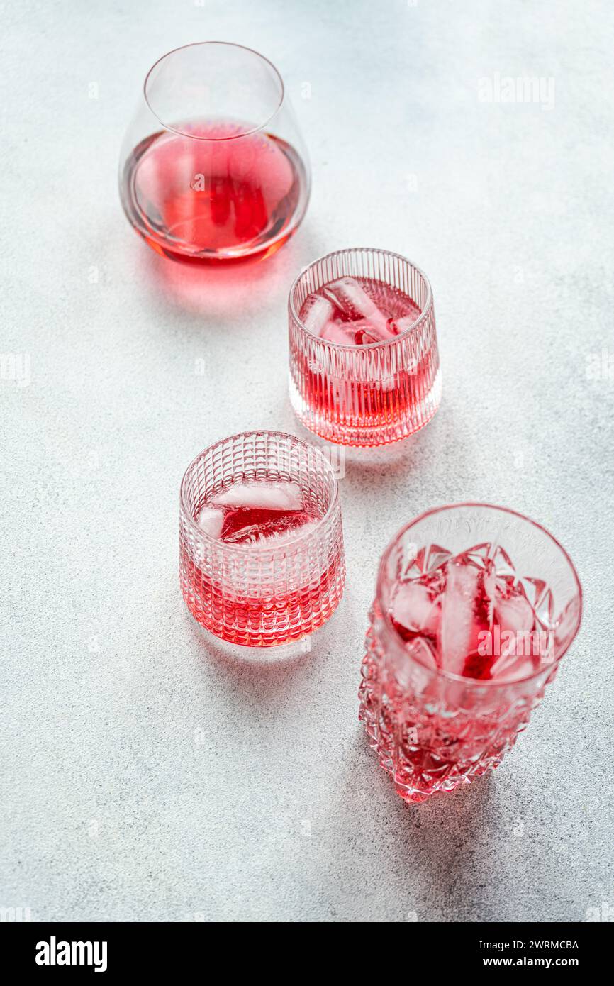 Top view of elegant glasses filled with a refreshing cherry vodka and ...