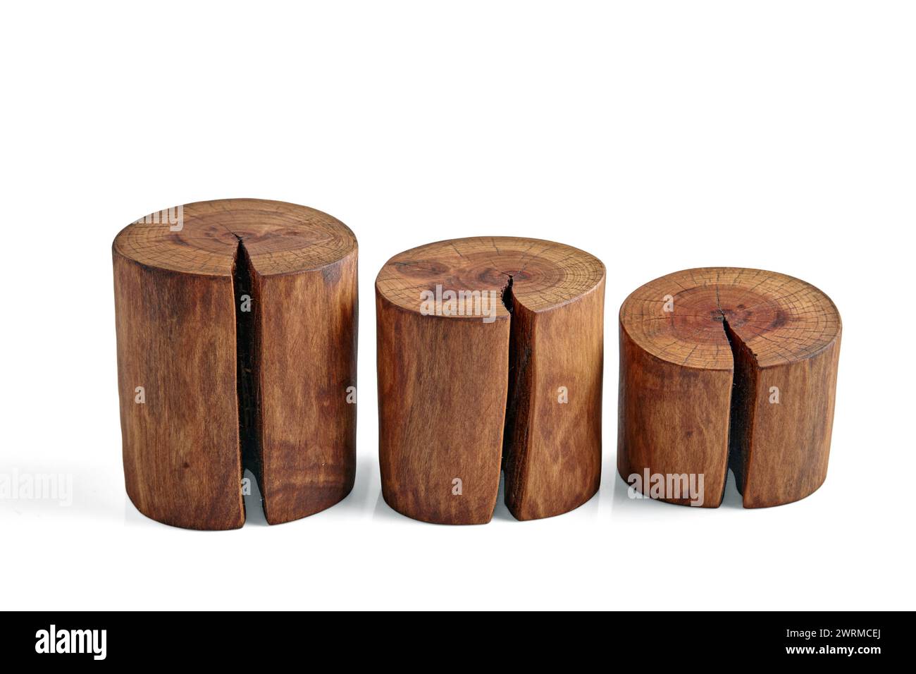 Three sawed tree trunks with a crack isolated on a white background ...