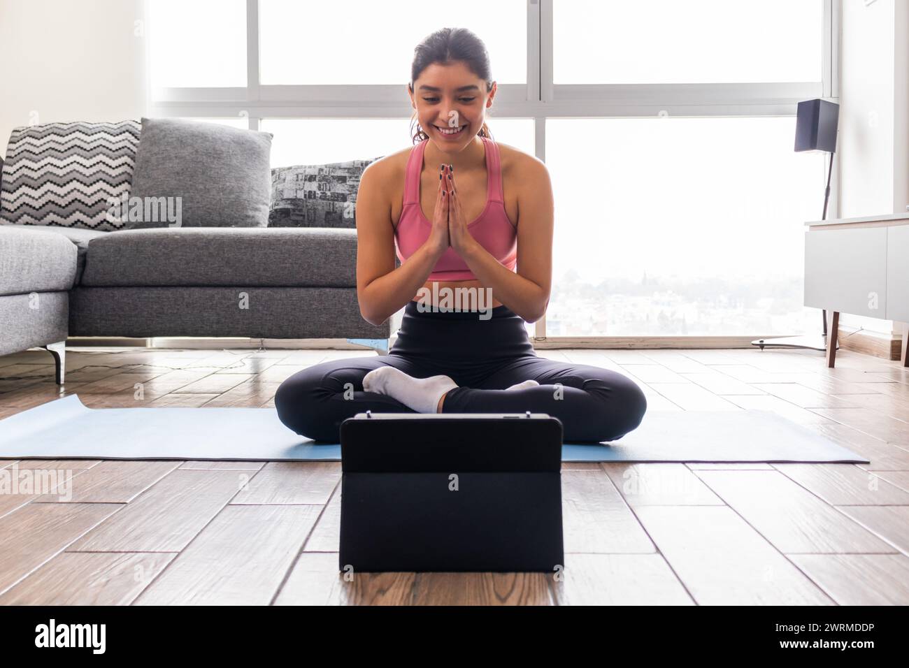 Yoga cross legged palms together hi-res stock photography and images ...